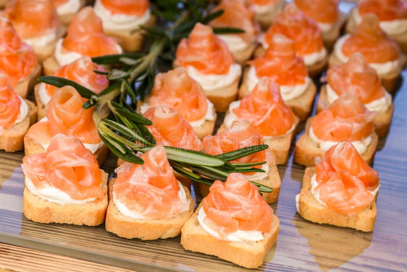 Mini Canapes with Smoked Salmon and Rosemary Sprig. Stock Image - Image ...
