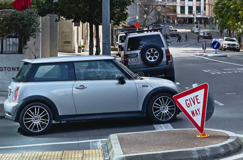 Mini Car Preparing To Turn with Give Way Road Sign Editorial Stock ...