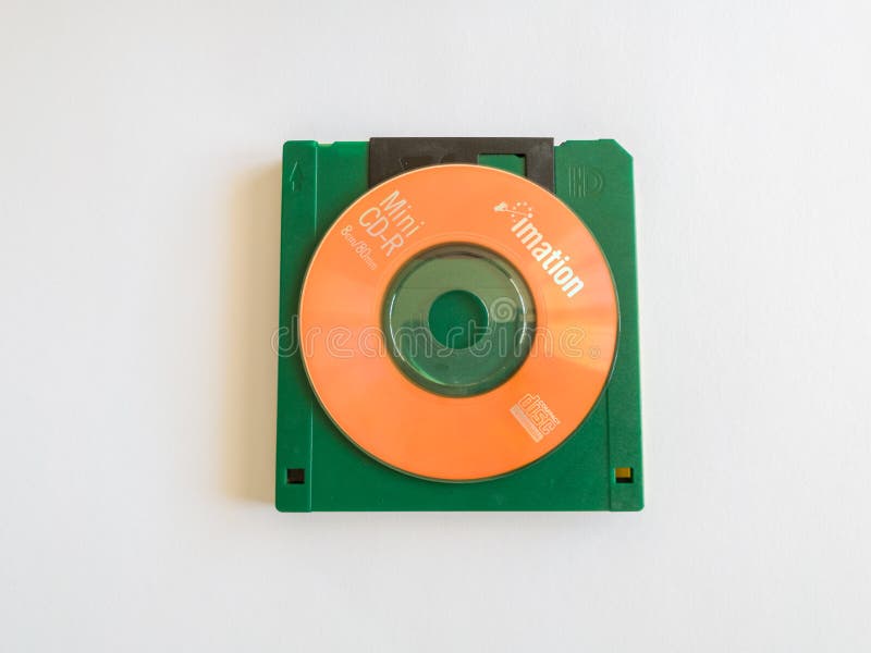 Mini CDs Stacked on Floppy Disks, Objects Isolated on a White ...