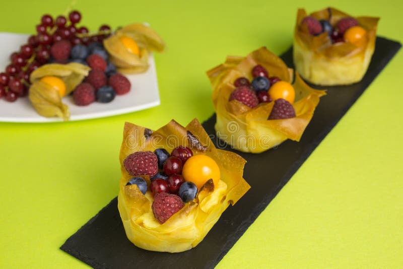 Mini Cheesecakes with Filo Pastry and Berries Stock Photo - Image of ...