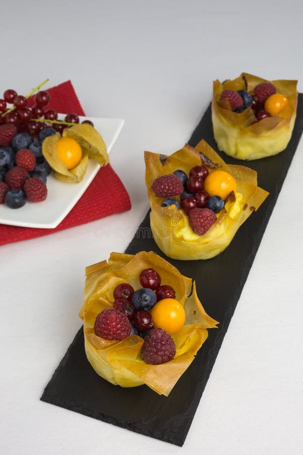 Mini Cheesecakes with Filo Pastry and Berries Stock Photo - Image of ...