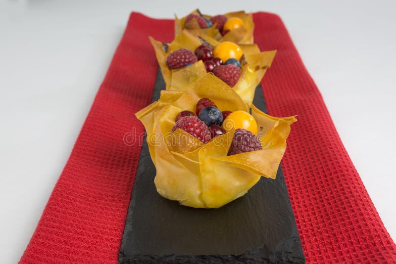 Mini Cheesecakes with Filo Pastry and Berries Stock Photo - Image of ...