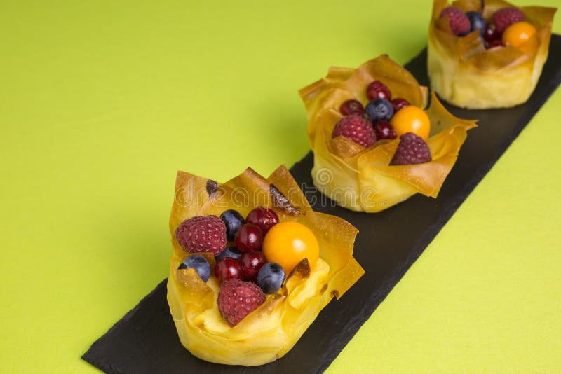 Mini Cheesecakes with Filo Pastry and Berries Stock Image - Image of ...
