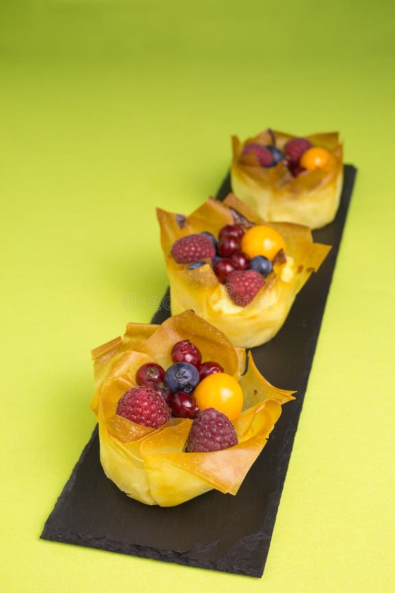 Mini Cheesecakes with Filo Pastry and Berries Stock Image - Image of ...