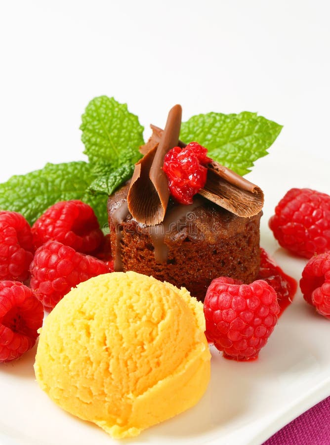 Mini Chocolate Cake with Fresh Raspberries and Ice Cream Stock Photo ...