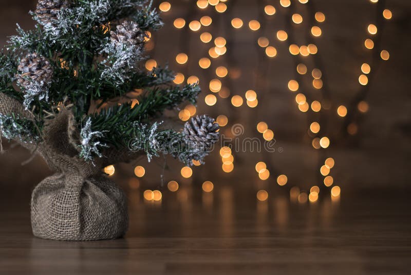 Mini Christmas Tree with Lights and Wood Background Stock Image - Image ...