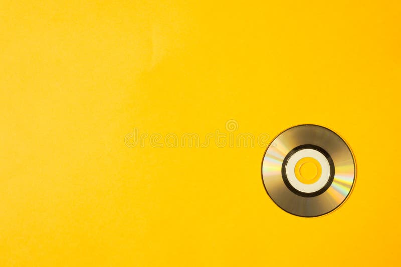 Mini Compact Disc on Yellow Background. Copy Space Stock Image - Image ...