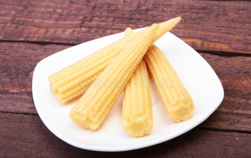 Mini Corn Cob Preserved on Plate on Wooden Board. Stock Image - Image ...