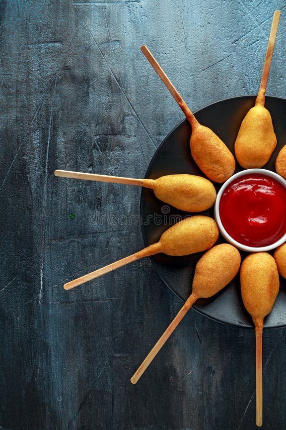 Mini Corn Dogs on Black Plate with Ketchup Stock Image - Image of corn ...