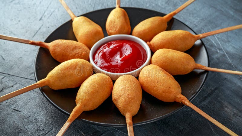 Mini Corn Dogs on Black Plate with Ketchup Stock Photo - Image of ...