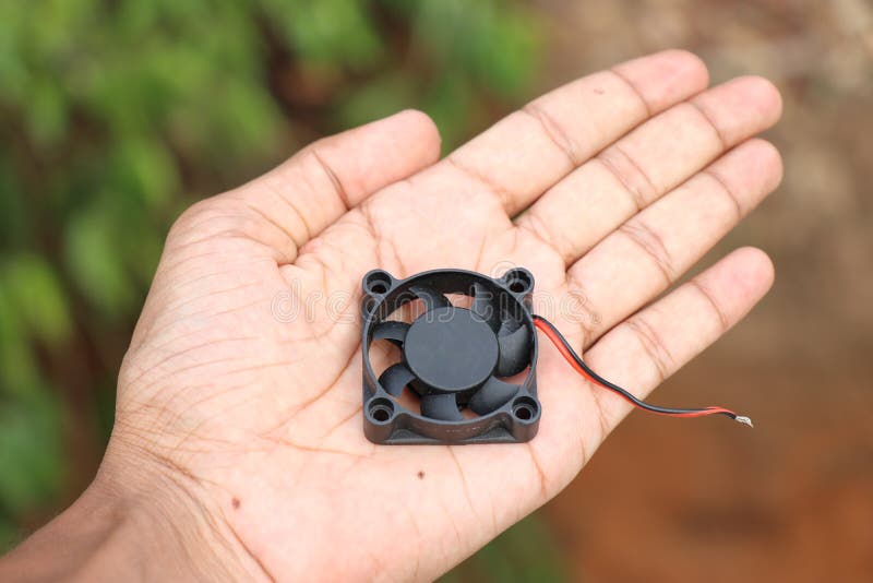 Mini CPU Cooler Held in Hand Stock Image - Image of held, computers ...