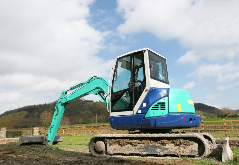 Mini Digger in Action stock photo. Image of fields, messy - 306536