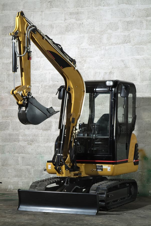 Mini excavator with driver stock image. Image of power - 4093653