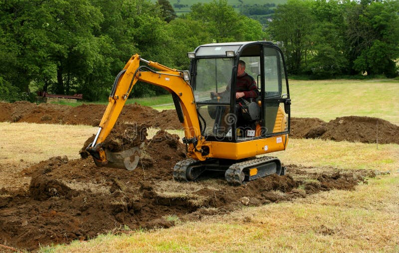Mini Digger in Action stock photo. Image of fields, messy - 306536