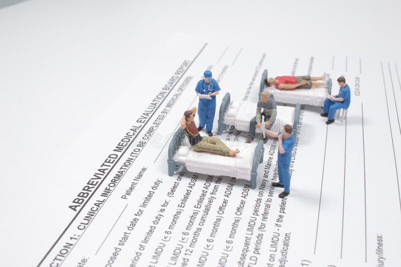 A Mini of Doctor Figure , with Medical Insurance Form Stock Photo ...