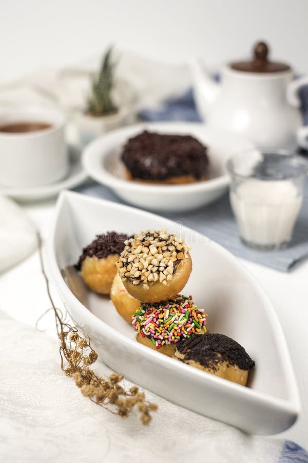 Mini Donuts and Sprinkles Stacked Portrait Stock Photo - Image of food ...