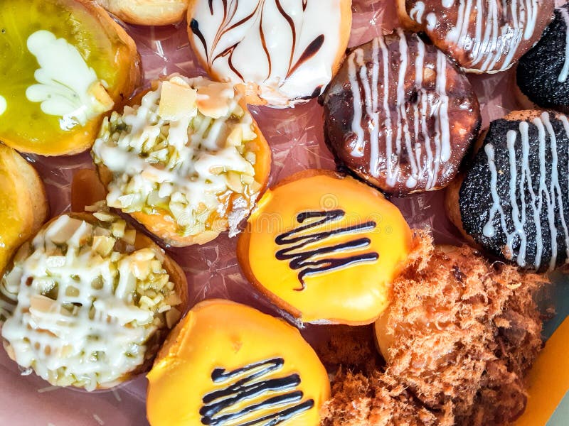 Mini Donuts with a Variety of Different Toppings and Glazes Stock Image ...