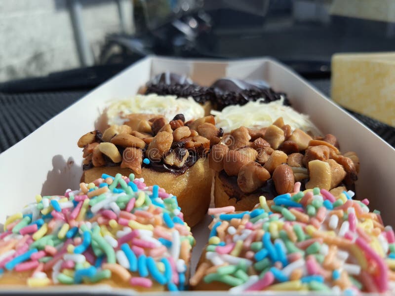 Mini Donuts with Various Toppings, in a White Box Stock Photo - Image ...