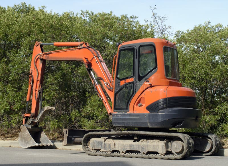 Mini excavator from back stock image. Image of earth, machinery - 2528769