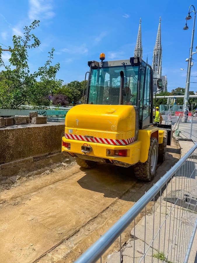 Mini Excavator and Builder S Skip on the Path Alongside in Vienna ...