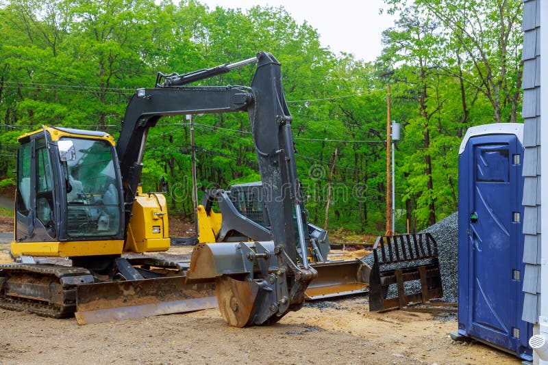 Mini Excavator on Construction Site for Working in Small Places Stock ...