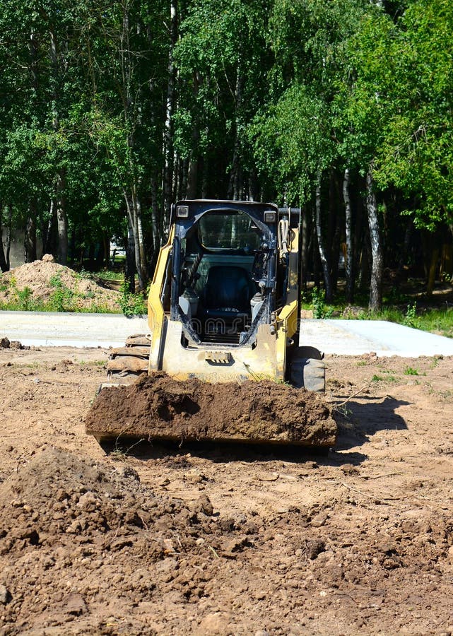 Mini Excavator Digging and Pushing Ground in Construction Site Stock ...