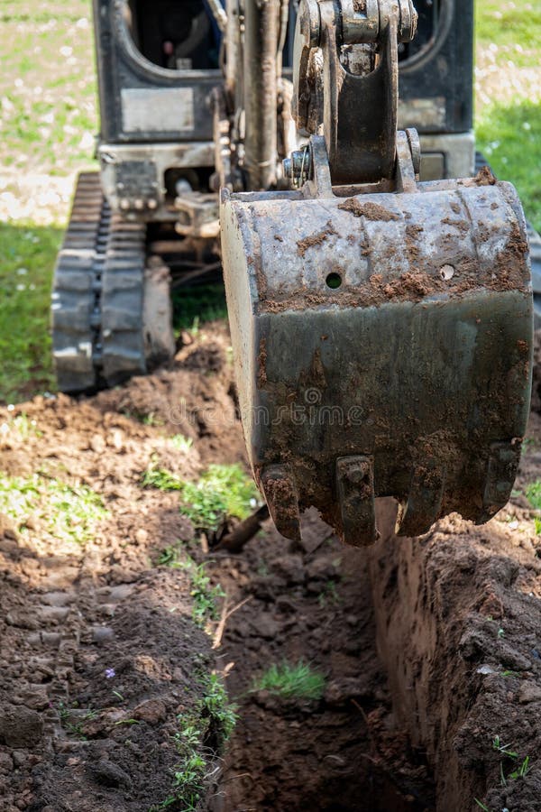 Excavator Dig Trench at Construction Site. Digging the Pit Foundation ...