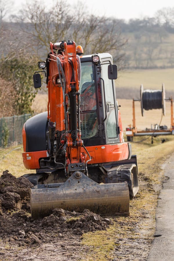 Mini Excavator Digging Up A Electrical Cables From Trench 3 Stock Photo ...