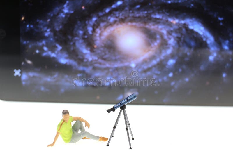 A Mini Figure of Astronomer with a Telescope Watching the Stars Stock ...