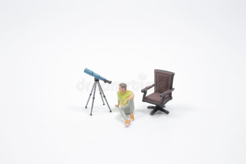 A Mini Figure of Astronomer with a Telescope Watching the Stars Stock ...