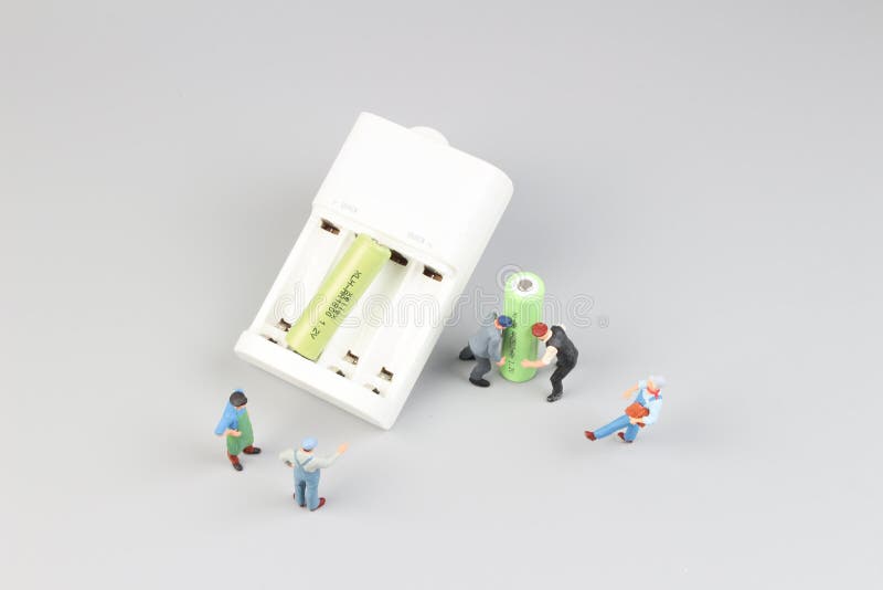 Mini Figure with Battery Charge Stock Image - Image of clip, collar ...