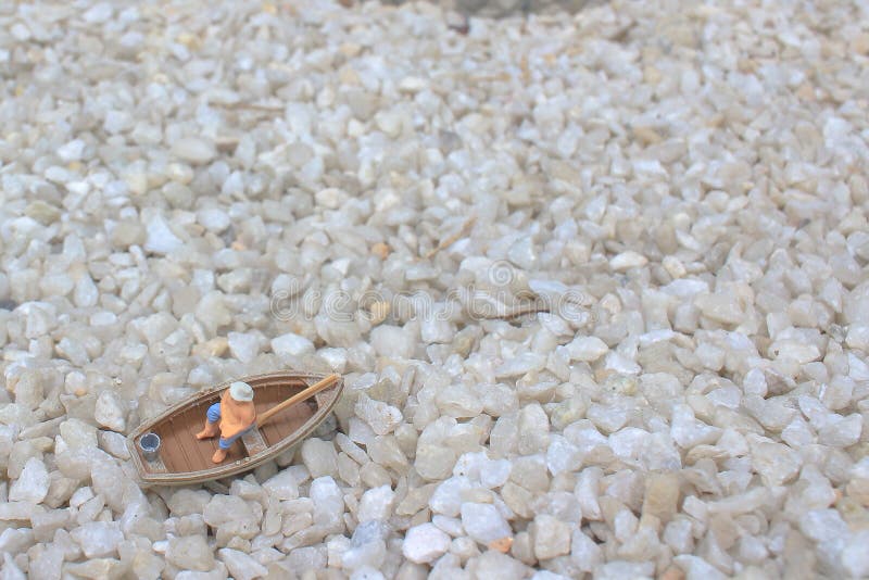 Mini Figure of Boat Fish on Stone River Stock Image - Image of ...