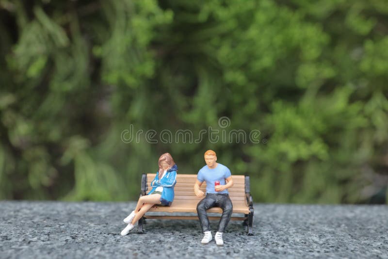 A Mini Figure Chatting on Park Bench Stock Image - Image of ...