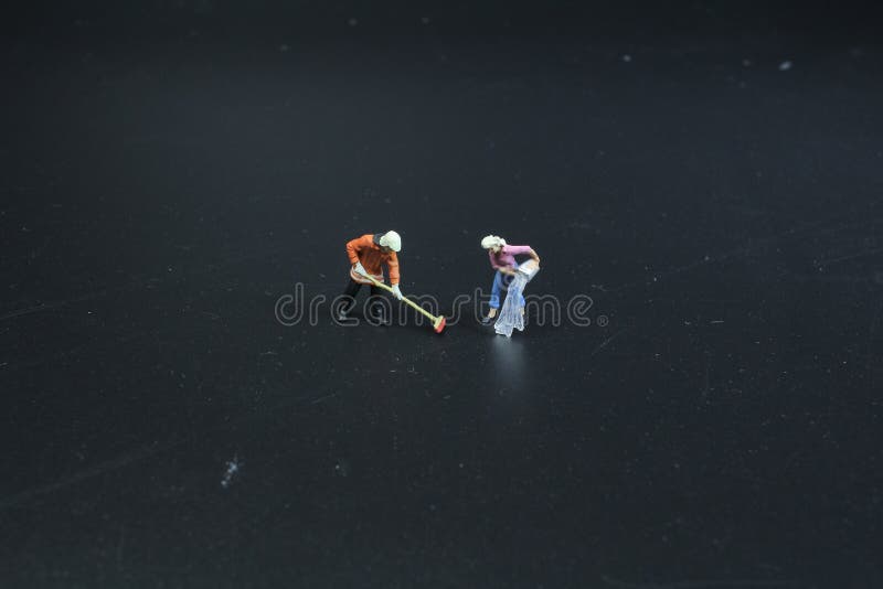 A Mini Figure are Clearing the Work Stock Photo - Image of road, world ...