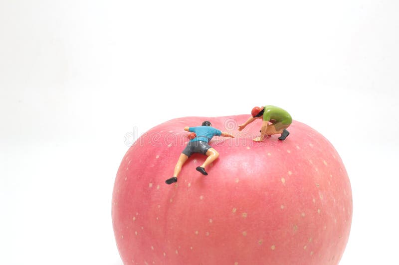 The Mini of Figure Climb the Apple Stock Photo - Image of white ...