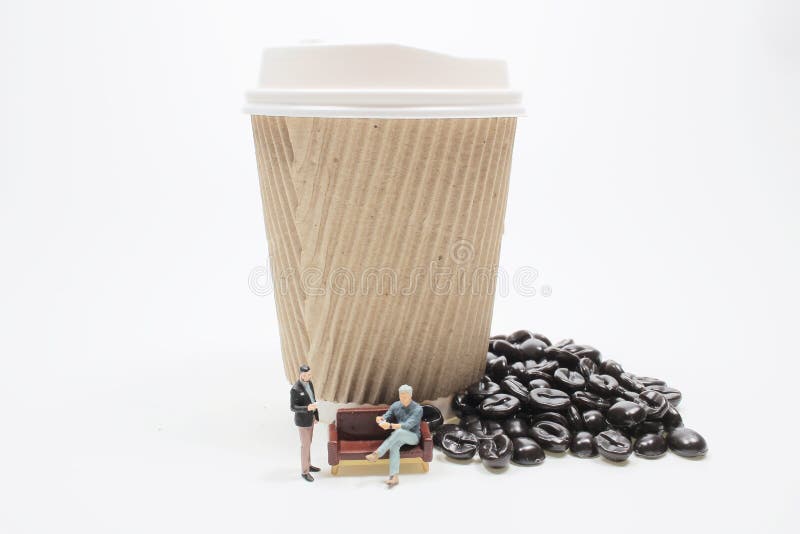 A Mini of Figure with the Coffee and Paper Mug Stock Image - Image of ...