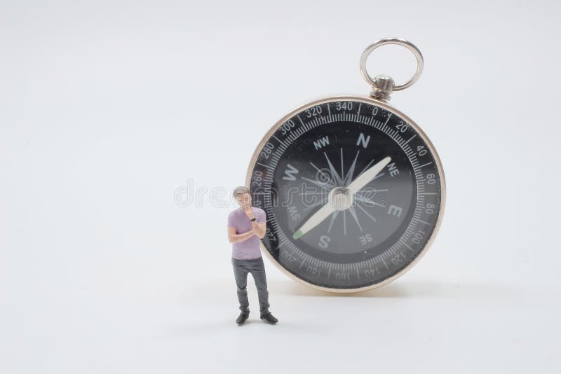 A Mini Figure with Compass Isolated on a White Background Stock Image ...