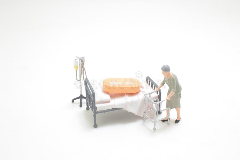 A Mini Figure Elderly Woman Using Walking Frame Stock Photo - Image of ...