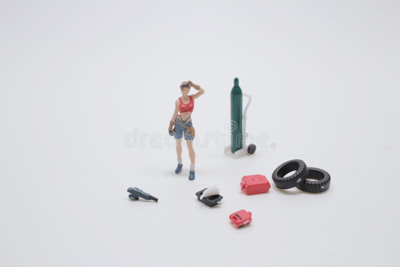 Mini Figure of Female Mechanic is Working on a Car Stock Photo - Image ...