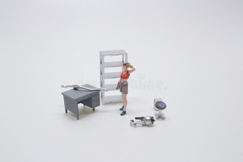 Mini Figure of Female Mechanic is Working on a Car Stock Photo - Image ...