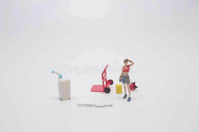Mini Figure of Female Mechanic is Working on a Car Stock Photo - Image ...