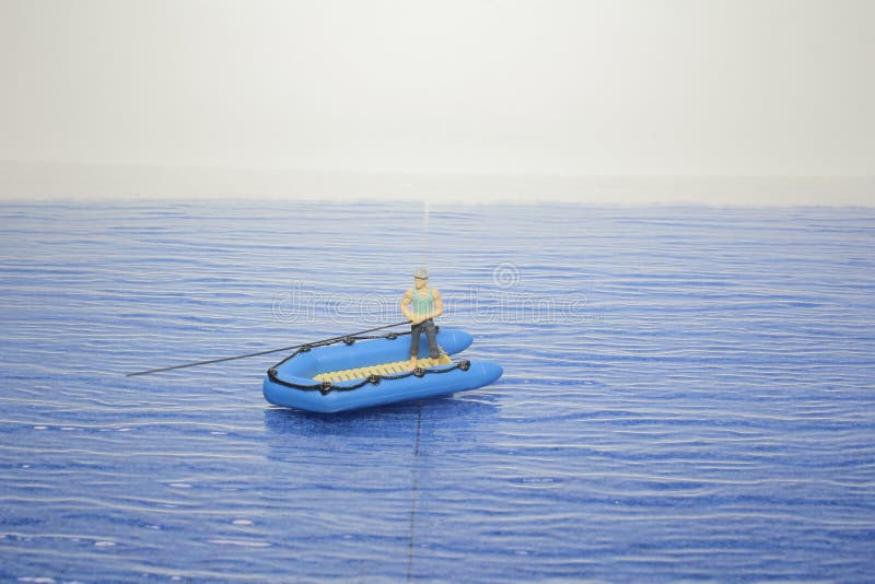 A Mini Figure Fishing at the Lake Stock Photo - Image of boat, energy ...