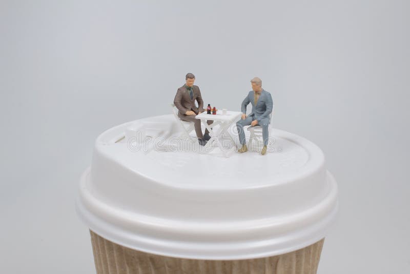 A Mini Figure Have Coffee during a Meeting on the Mug Stock Image ...