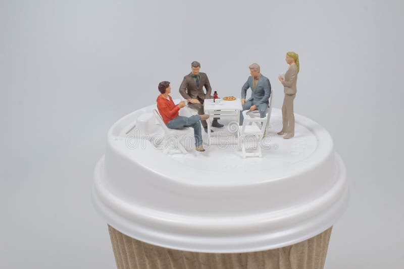 A Mini Figure Have Coffee during a Meeting on the Mug Stock Photo ...