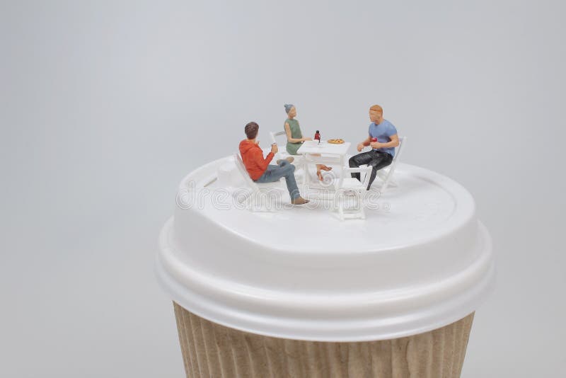 A Mini Figure Have Coffee during a Meeting on the Mug Stock Photo ...