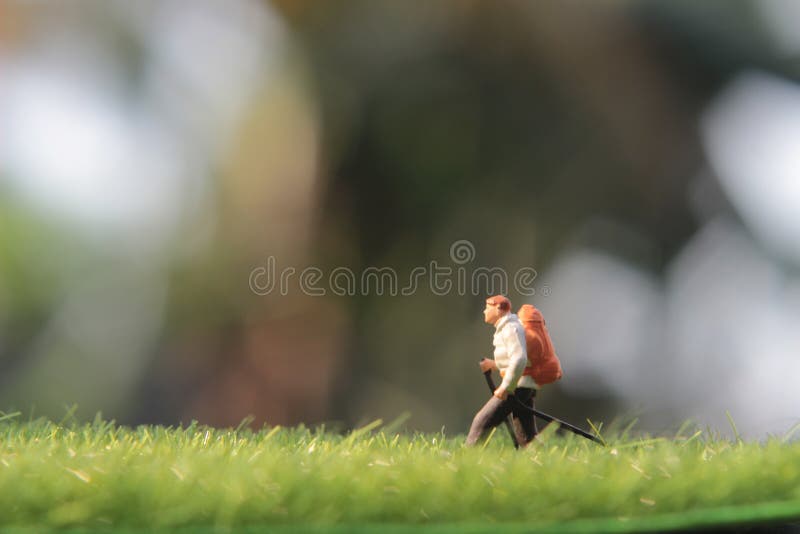 Mini Figure Hiker, Walking at Grass Field Stock Image - Image of ...