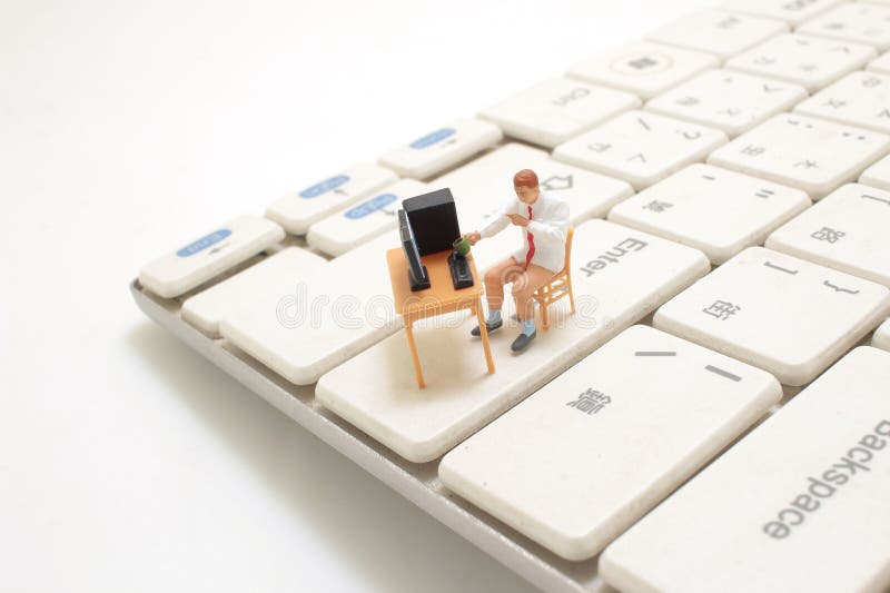 Mini Figure in the Home Office on Keyboard Stock Photo - Image of ...