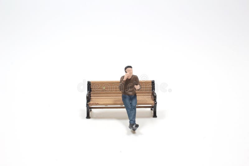 A Mini Figure Man Sit on the Park Seat Stock Photo - Image of corporate ...
