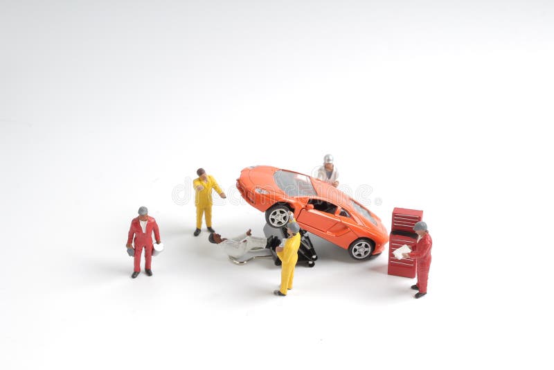 The Mini Figure Mechanics Working on Car Stock Photo - Image of ...