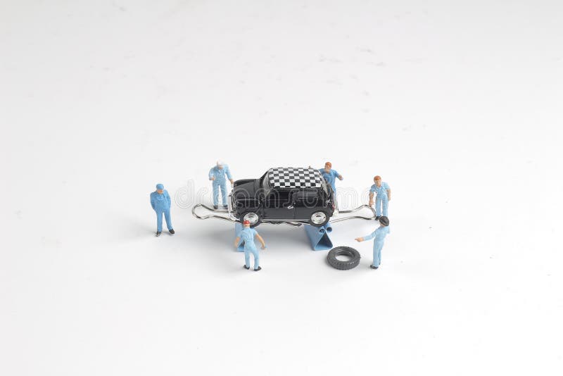 Mini Figure Mechanics Working on a Car Stock Image - Image of city ...